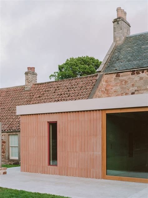 Pend Wraps Extension To Historic Scottish Home In Pink Toned Stonework
