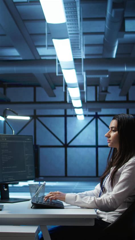 Vertical Teamworking Colleagues In High Tech Data Center Managing And