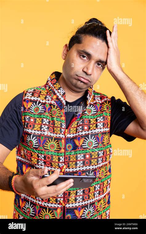 Gamer Playing Online Multiplayer Videogame On Smartphone Annoyed After