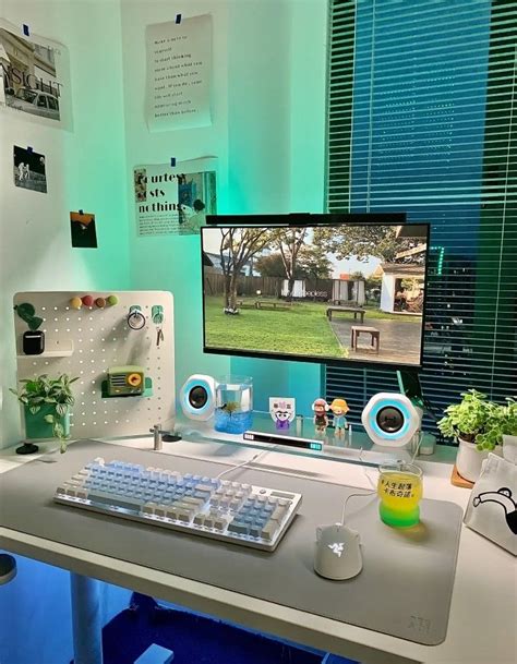 A Computer Desk With A Keyboard Mouse And Monitor On It In Front Of A Window