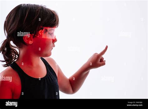 Adorable Girl In Red Digital Glasses With Dark Hair Touching Invisible