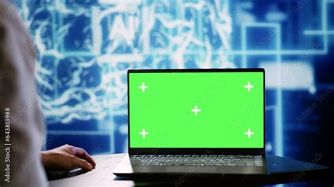 Computer Scientist Using Green Screen Laptop To Implement Artificial Intelligence Parallel