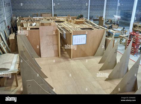 Interior View Of A Construction Workshop Focusing On An Active Wooden Framework Assembly For A