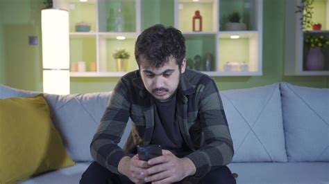 The Depressed Lover Who Receives A Breakup Message Is Disappointed Unhappy And Angry Young Man