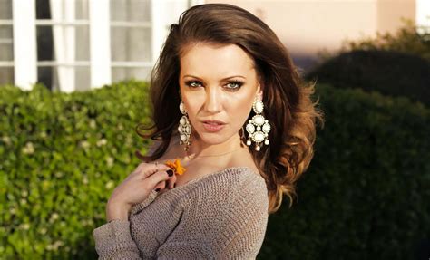 Download Katie Cassidy Striking A Captivating Pose Wallpaper