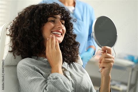 Patient Looking In Mirror And Doctor In Clinic Selective Focus Dental