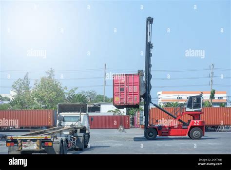 Container Stacker Load The Container Into The Truck Transportation Concept Stock Photo Alamy