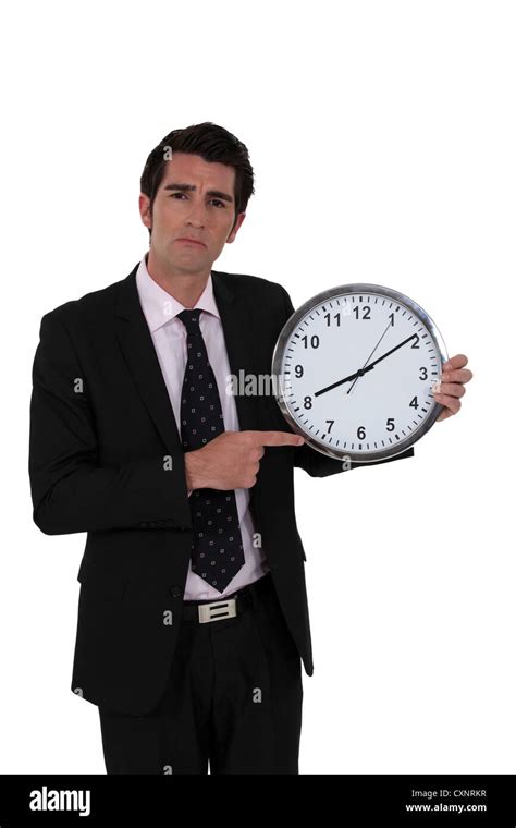 Man Pointing At Clock Stock Photo Alamy