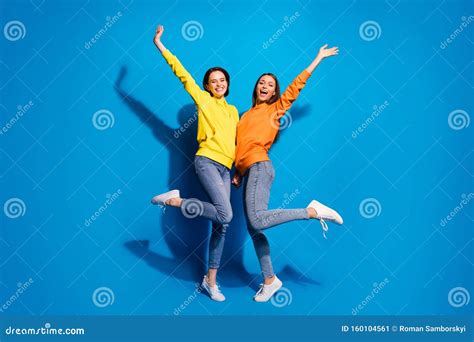 Full Body Photo Of Two Pretty Ladies Raising Arms Up Calling People To