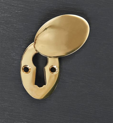 Raised Oval Door Knobs Polished Brass