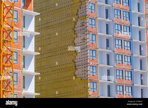 Cladding And Warming Wall Of Monolithic House Under Construction Insulating Wall Facade Of