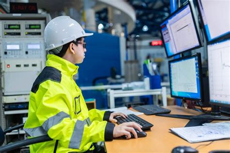 Premium Photo Inside The Large Industry Factory Female Computer Engineer Works On Personal