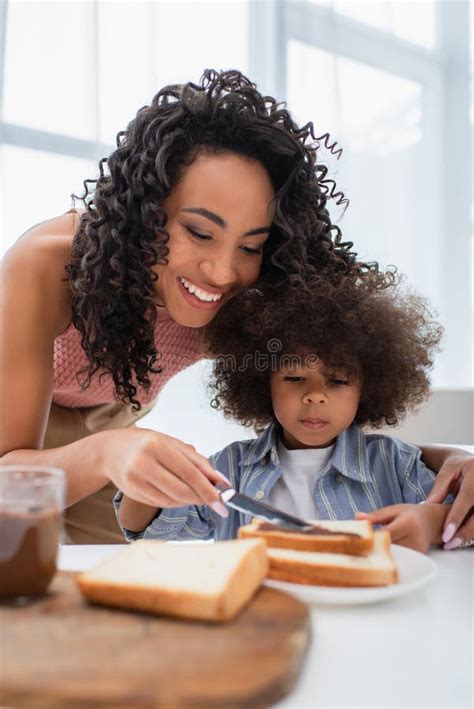 African American Woman Spreading Chocolate Paste Stock Photo Image Of