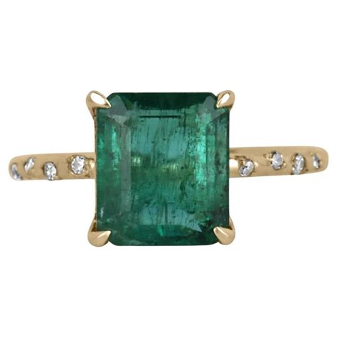 522tcw Freckled Dark Green Emerald Emerald Cut And Diamond Accent