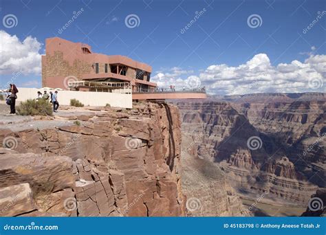 Tourist Enjoying The View Of The West Rim Of The Grand Canyon From The