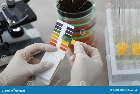 Litmus Ph Test With Color Scale And Digital Conductivity Tester Stock