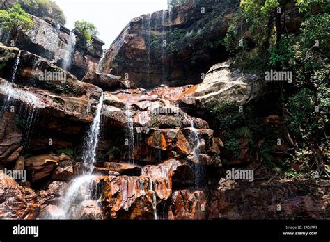 Spectacular Prut Waterfall With Red Rocks Surrounded With Lush Tropical Vegetation In