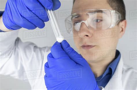Medical Laboratory Assistant Checks A Test Tube With Sperm Spermogram Male Fertility Test