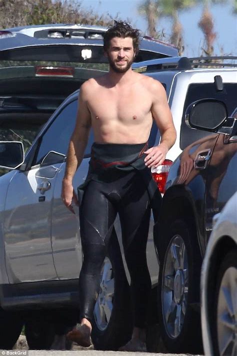 Liam Hemsworth Shows Off His Buff Physique In A Wetsuit In Malibu