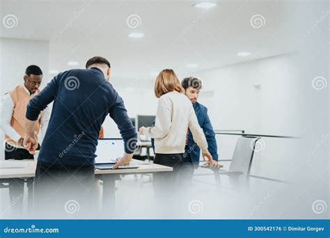 Multiracial Corporate Team Collaborating On Project Development Discussing Statistics And Sales