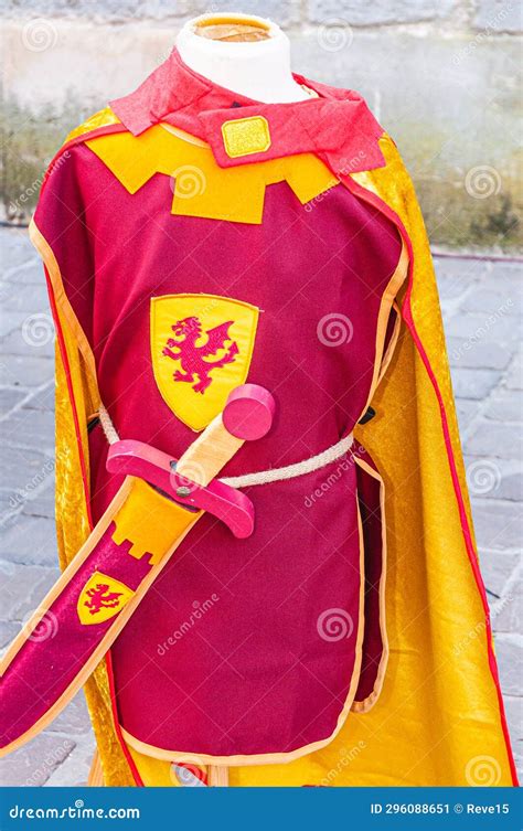 Mid Evil Knights Jousting Costume With With Wooden Sword Stock Image