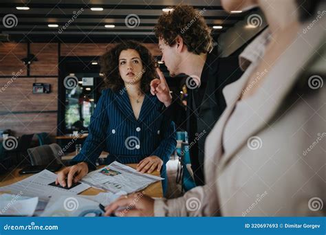 Business Colleagues Having A Misunderstanding And Arguing In A Modern Office Setting Stock Image