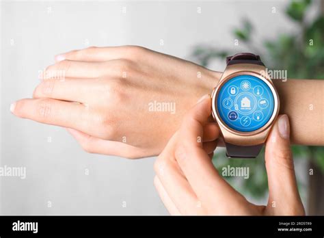 Woman Setting Smart Home Control System Via Smartwatch Indoors Closeup App Interface With