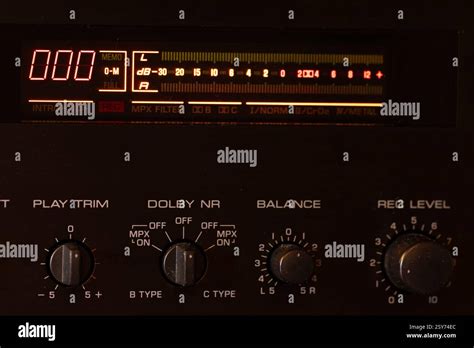 Close Up Of A Retro Audio Tape Deck With Backlit Panel Analog Controls And Dials Displaying A