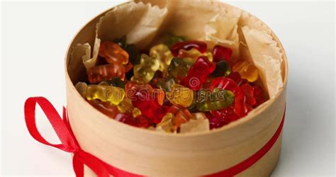 Rotation Tasty Jelly Bears Candy In Present Box On White Background
