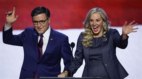 Mike Johnsons Wife Kelly Dons Bright Orange Pantsuit With Major Trump