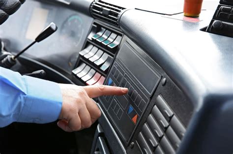 Premium Photo Bus Driver Pushing Button On Panel