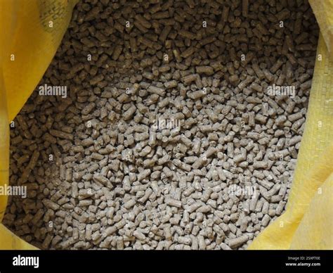 Chicken Feed Pellets In Yellow Plastic Bag Close Up Feeding Poultry