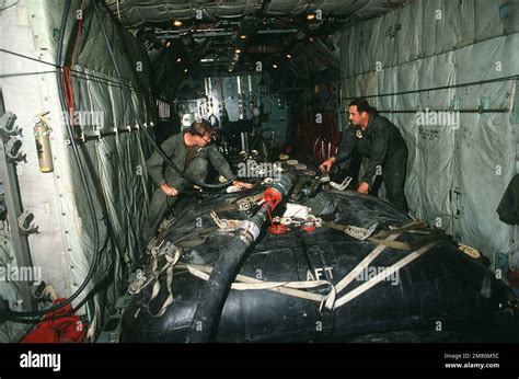 A Fuel Bladder Is Anchored By Cargo Straps In The Cargo Bay Of A C 130