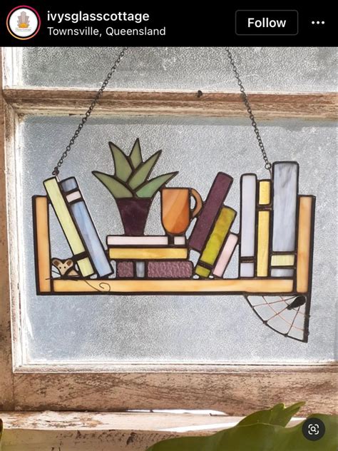 Stained Glass Window With Hanging Books And Plants