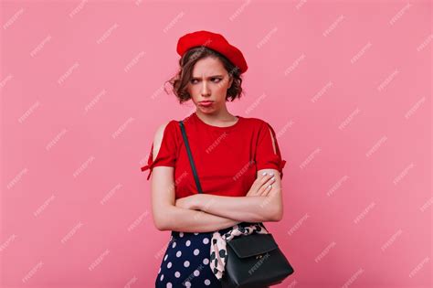 Free Photo Sad French Woman In Red Attire Posing With Arms Crossed