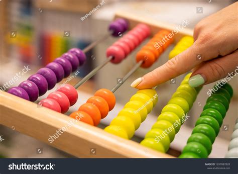 Closeup Female Hand Calculating Balls On Stock Photo 1697887828 Shutterstock