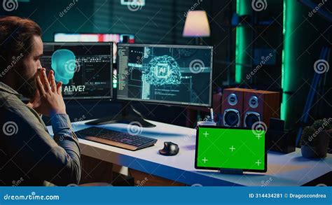 developer using green screen tablet updating artificial intelligence