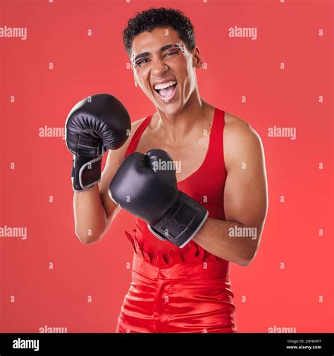 Boxing Gloves And Portrait Of A Gay Man Excited For A Fight Isolated On A Red Background In