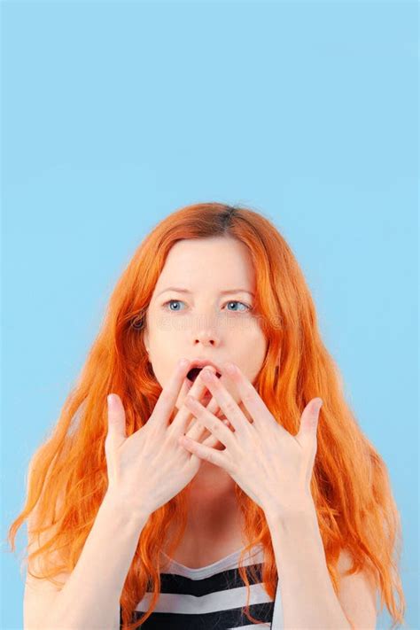 Redhead Girl Covers Her Mouth With Her Hand Surprise And Shock Stock Photo Image Of Female