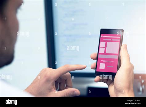 Mobile Application Development Programmer With Smartphone In Hand