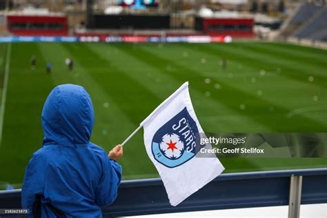 A Fan Holds A Flag With The New Chicago Stars Logo At Seat Geek News