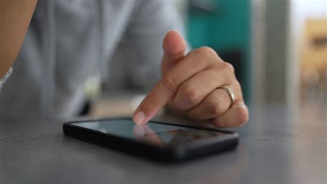 close up hand scrolling media on cellphone stock footage sbv 348860039
