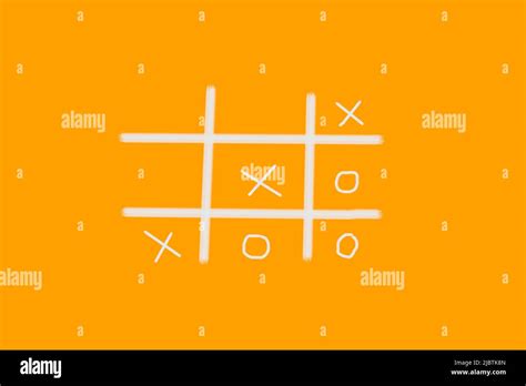 Tic Tac Toe Game On An Orange Background Stock Photo Alamy