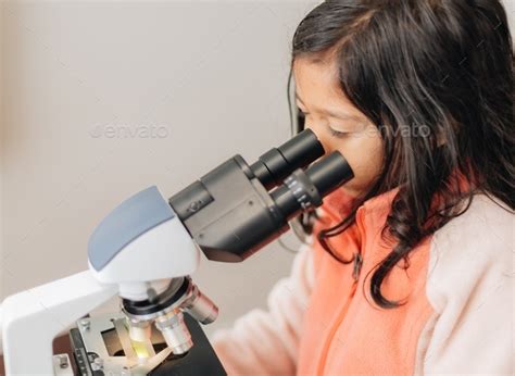 Diverse Pre School Girl At Home During Summer Break Exploring Science