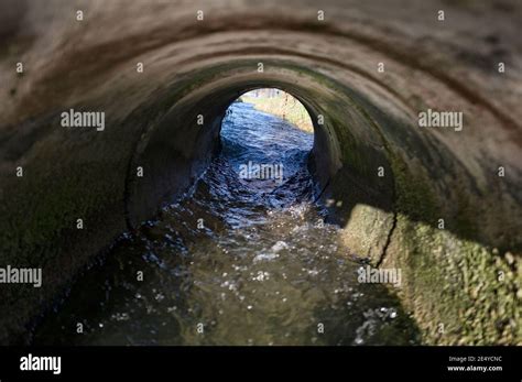 Water Flowing Inside Irrigation Ditch Between Fields Stock Photo Alamy