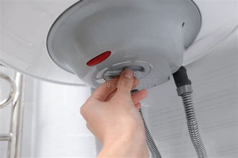Woman Adjusting Maximum Energy Efficiency Indicator Indoors Closeup