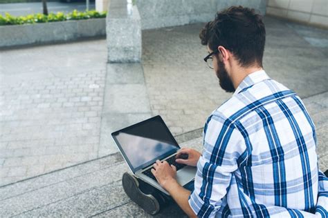 Free Photo Over The Shoulder View Of Man Coding On Laptop