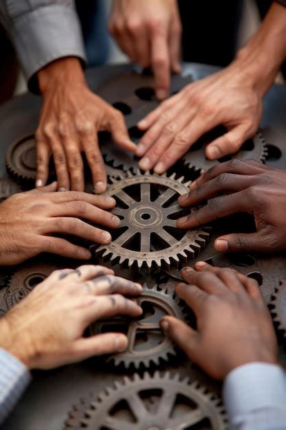 Photo Capturing A Closeup Of Interconnected Gears Symbolizing Teamwork And Collaboration In