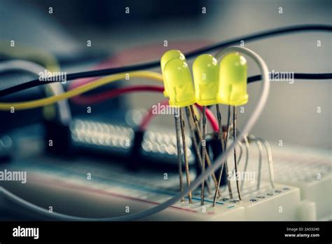 A Portrait Of An Electronic Circuit Of LEDS On A Breadboard With Wires All Around Them Stock