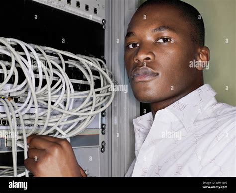 Portrait Of Network Engineer Working In Server Room Stock Photo Alamy